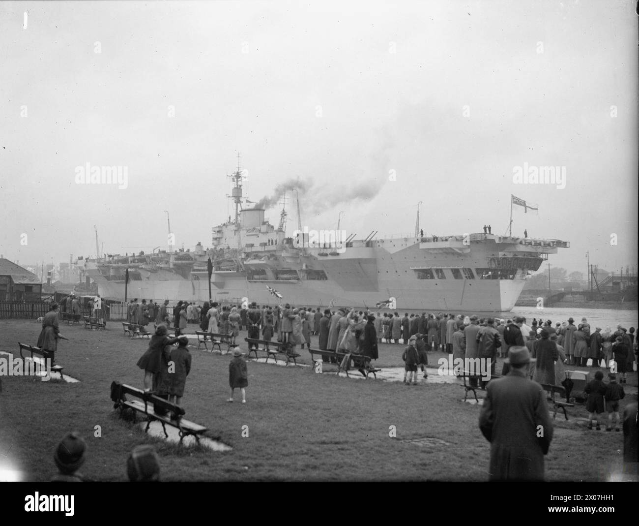 HMS Implacable, a British aircraft carrier, is towed from the Fairfield ...