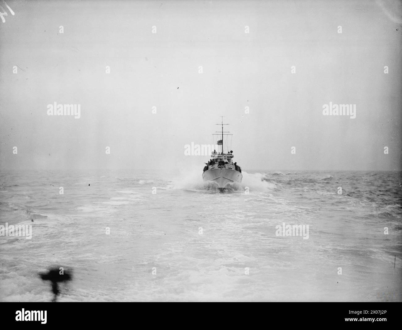 A bow view photograph of a C-class Motor Gun Boat (MGB) at sea with the ...