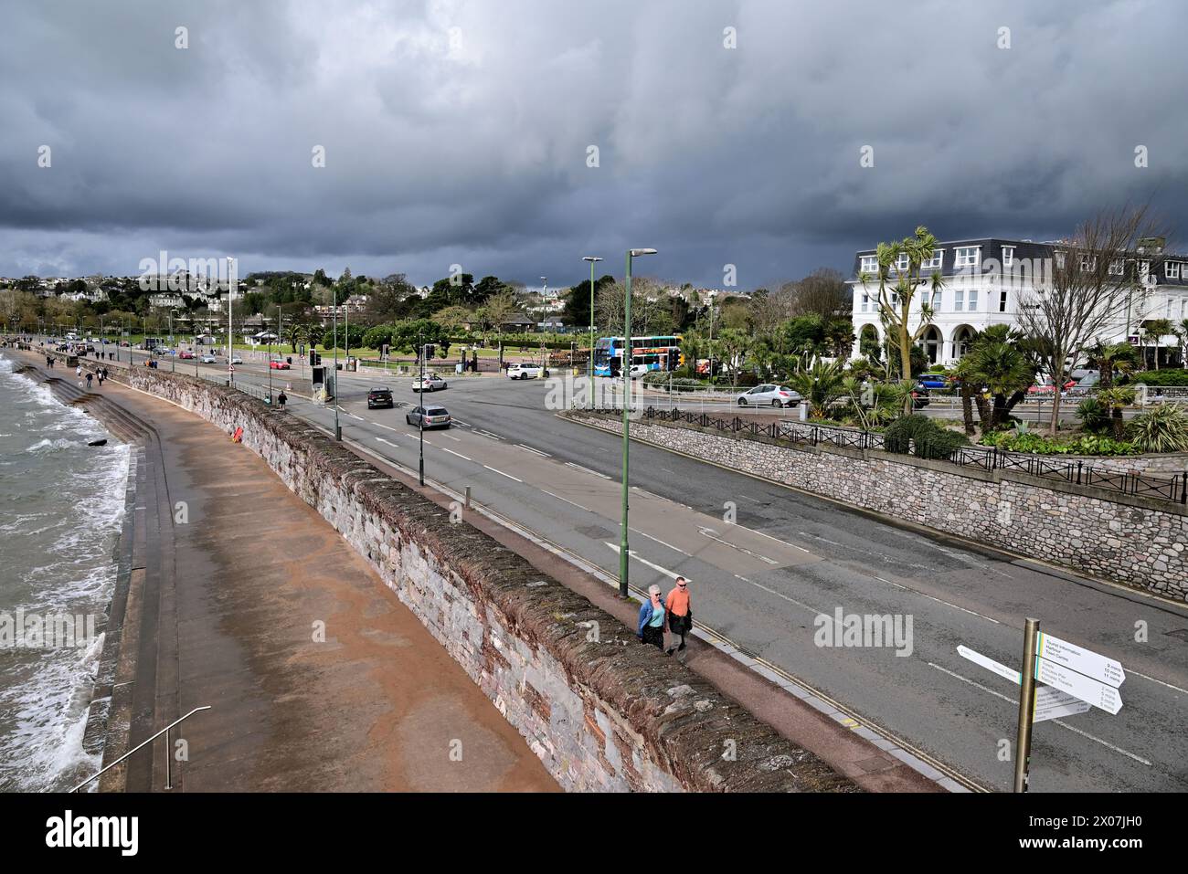 Sunshine and dark clouds over Torquay seafront as rain approaches Stock ...