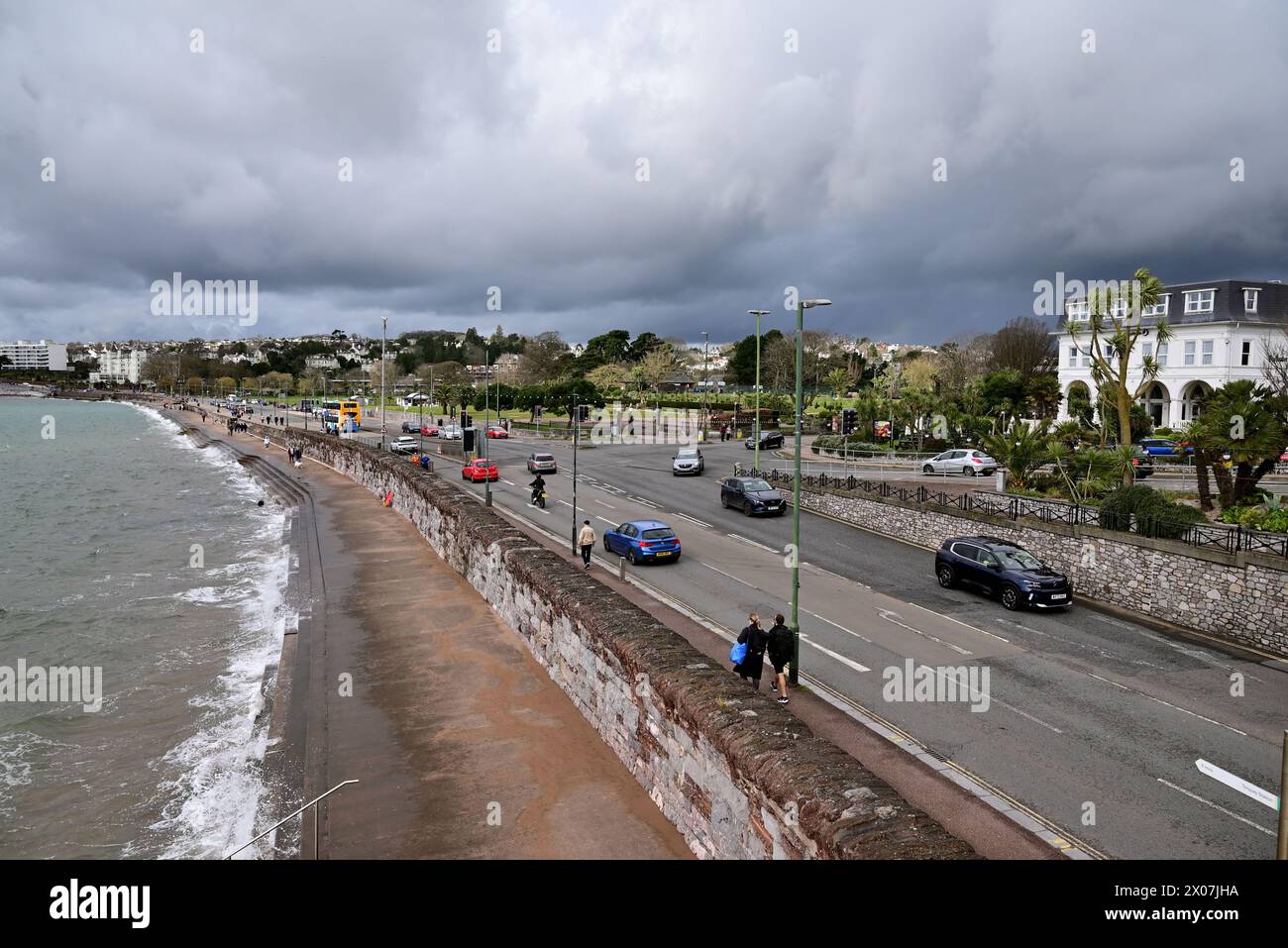 Sunshine and dark clouds over Torquay seafront as rain approaches Stock ...