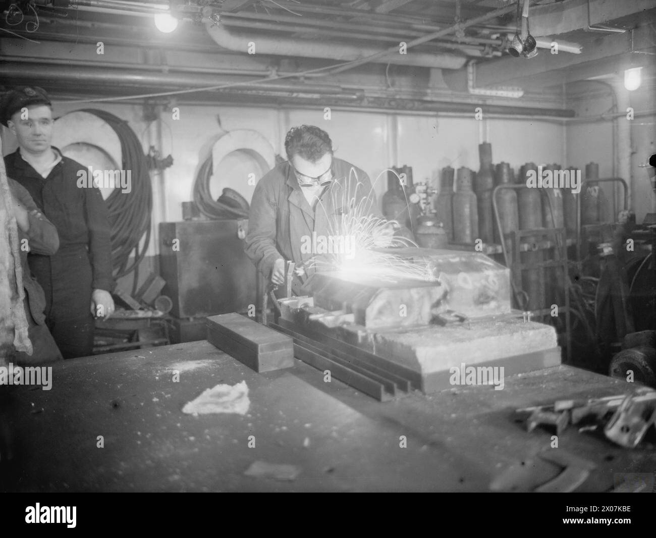THE DAILY ROUTINE OF HMS TYNE, A DESTROYER DEPOT SHIP. FLEET ANCHORAGE ...