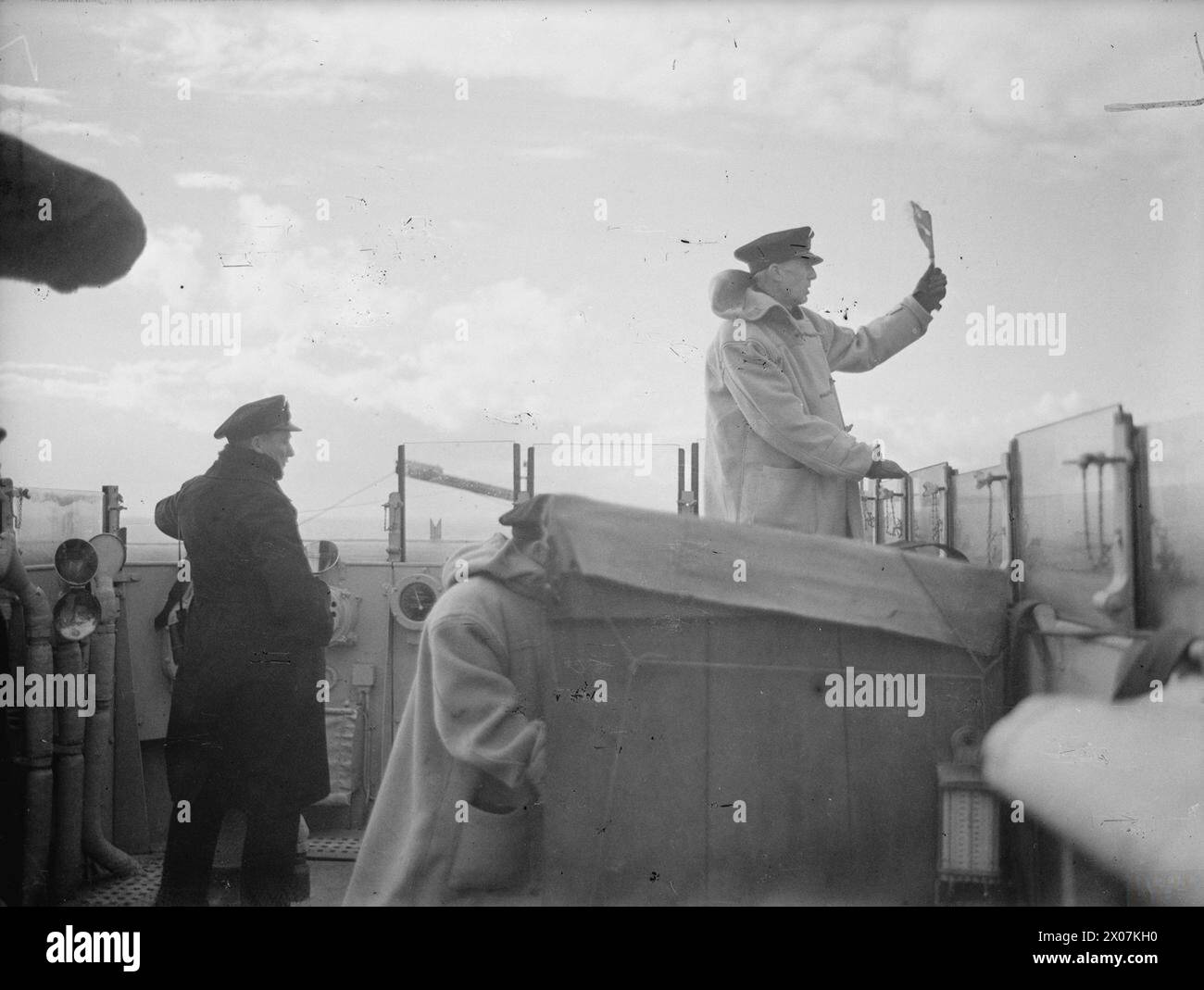 ON BOARD THE AIRCRAFT CARRIER HMS ARGUS. 1940. - The captain waves "all ...