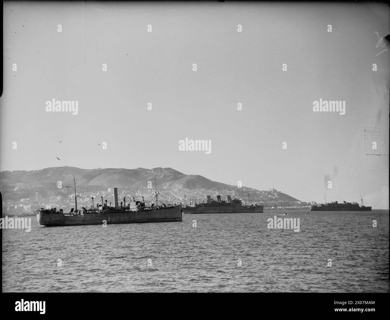 Royal Navy transports and warships are positioned off Algiers during ...