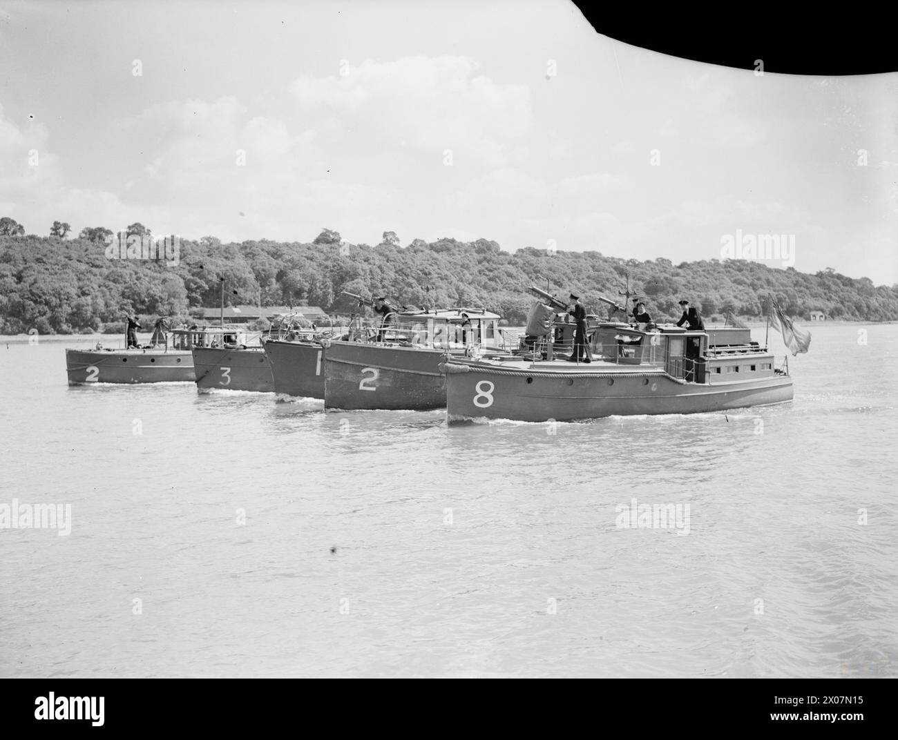 The Royal Naval Auxiliary Patrol resumes river patrol in line abreast ...