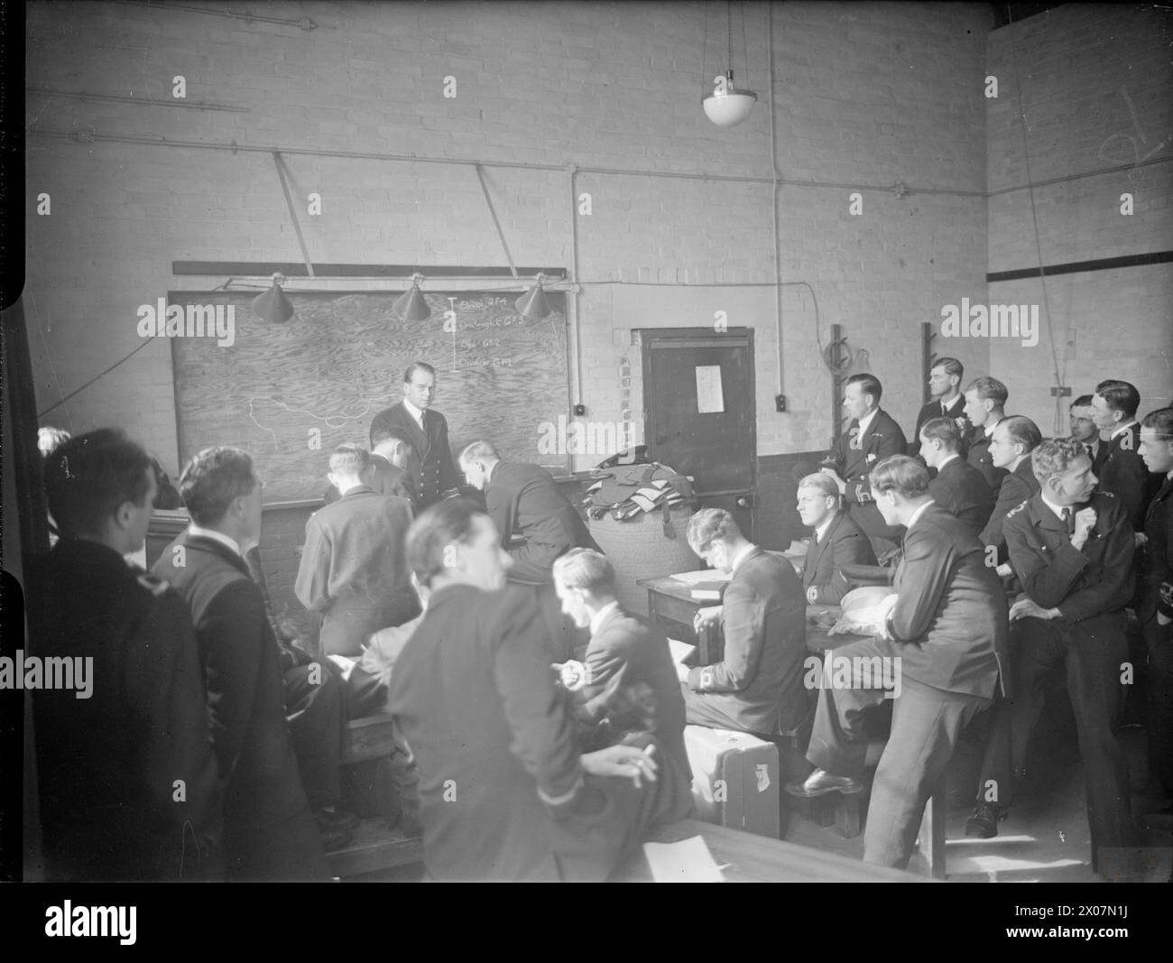 Lieutenant Commander Peter Scott briefs motor torpedo boat officers at ...