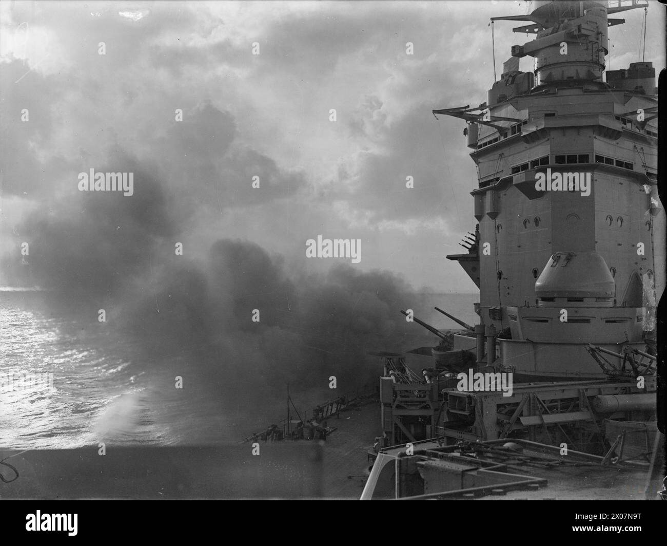 ON BOARD THE BATTLESHIP HMS RODNEY AT SEA. 1940. - HMS RODNEY firing ...