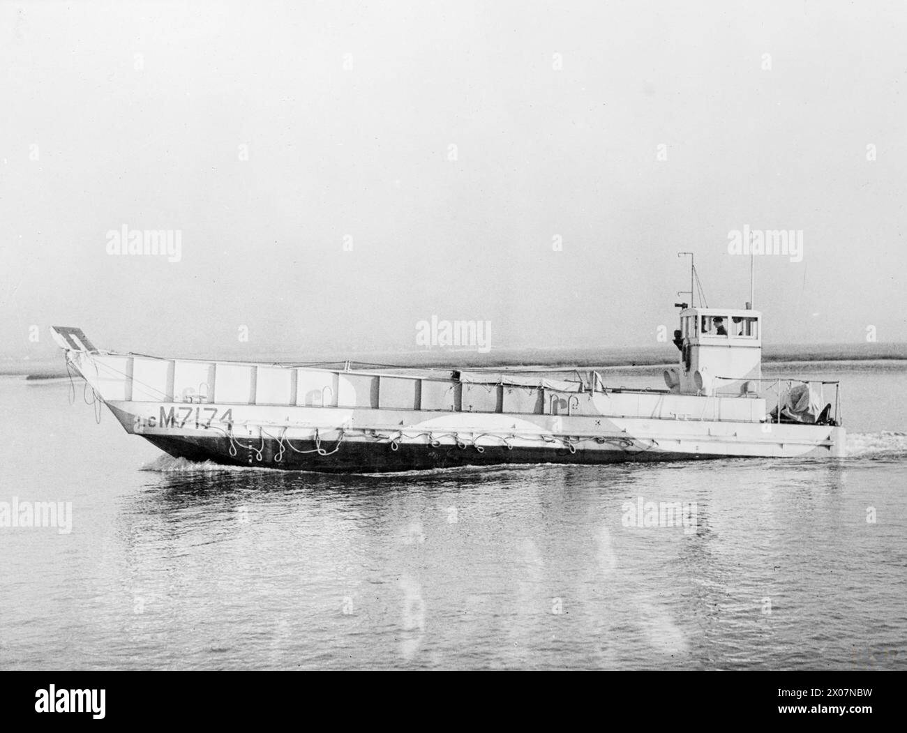 LCM 7174, a Landing Craft Mechanised, is operating at sea in 1945, used ...