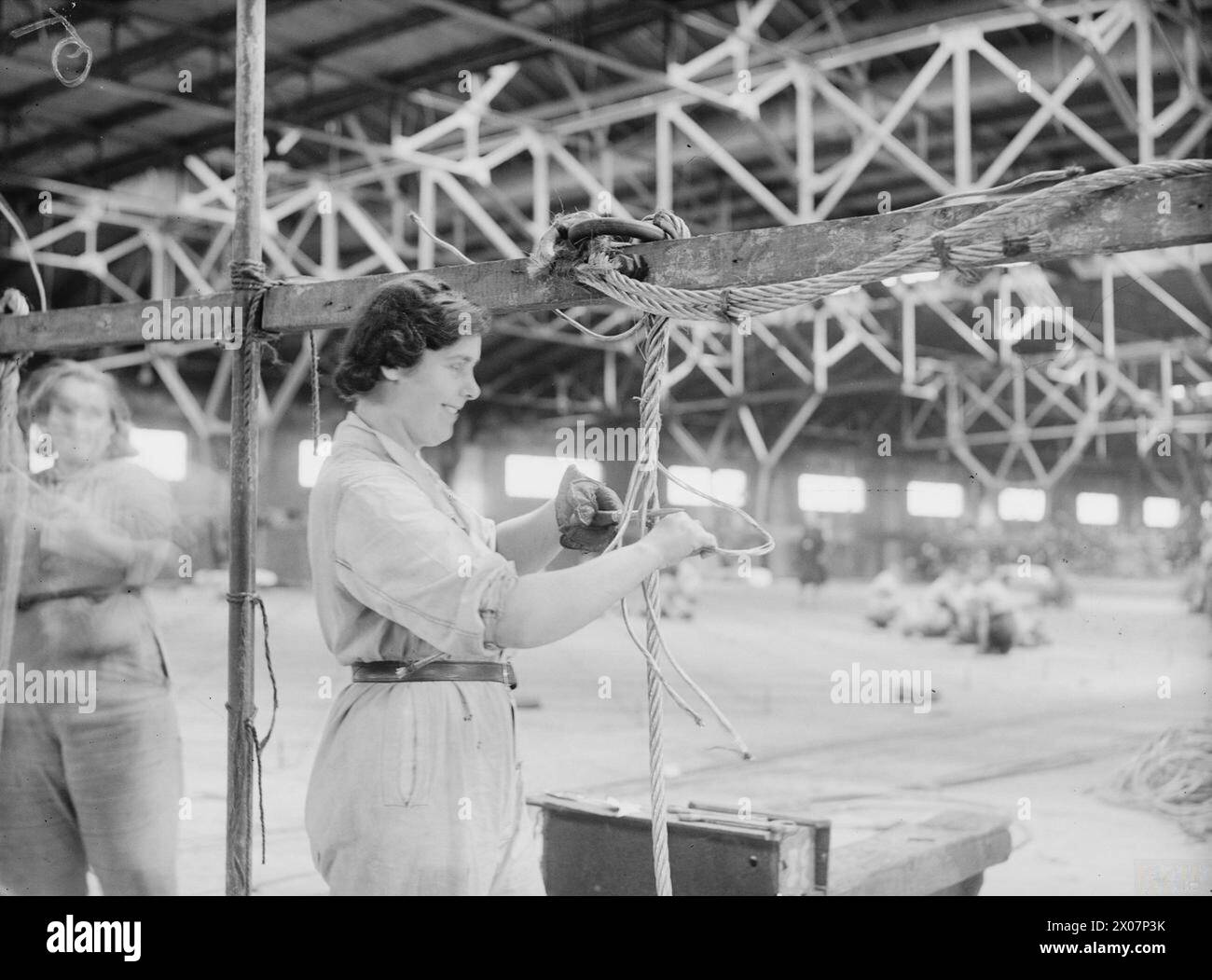 Women in Southampton construct boom defense nets on 13 October 1942 ...