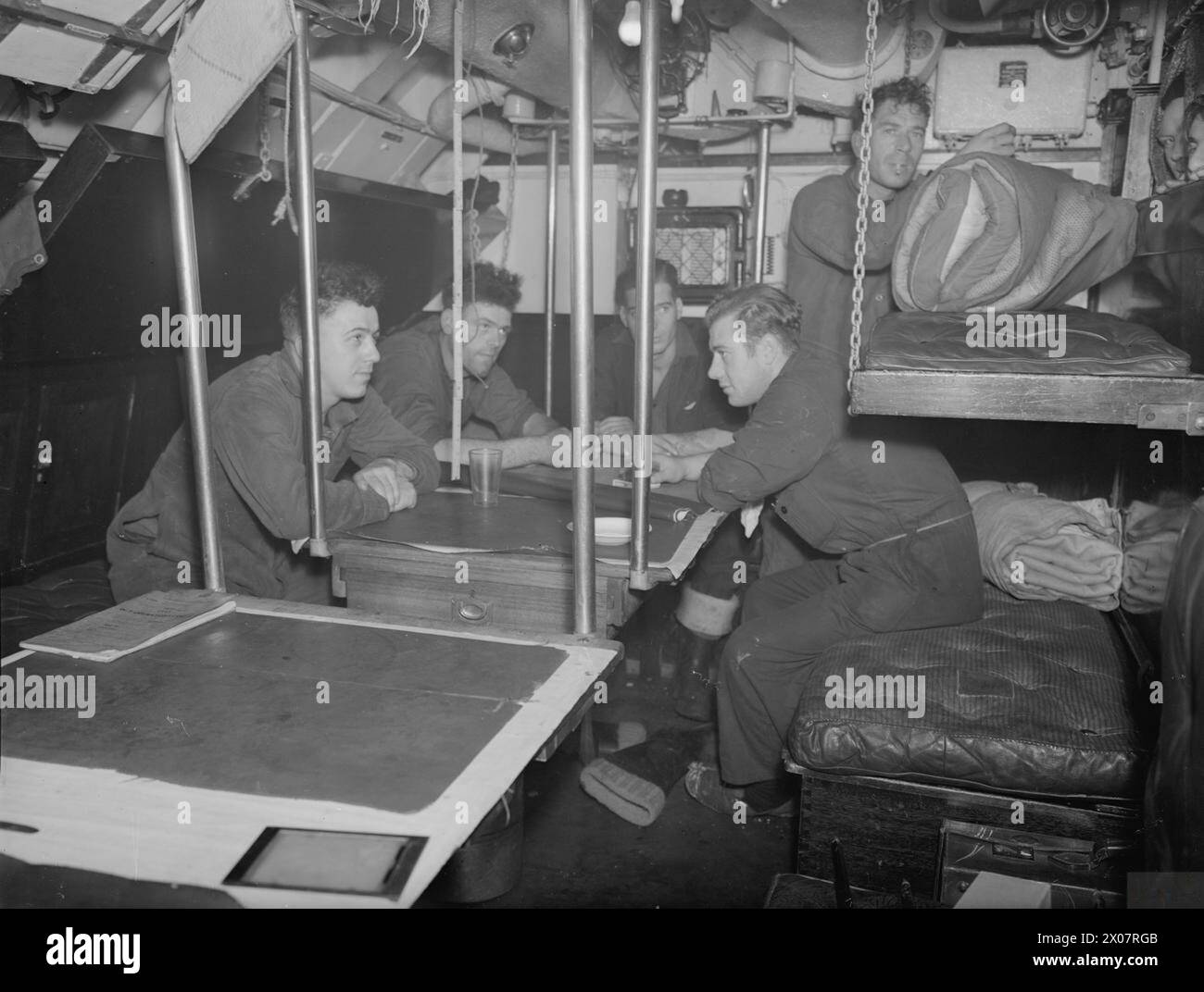 In July 1942, the interior of HM Submarine Tribune at Scapa Flow shows ...