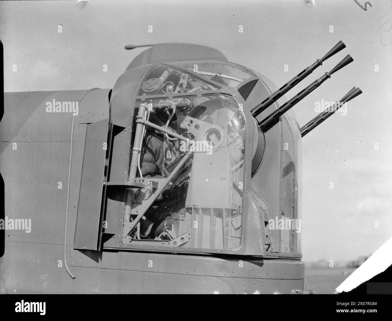 ROYAL AIR FORCE BOMBER COMMAND, 1939-1941. - An air gunner sits at the ready in the Nash and ...