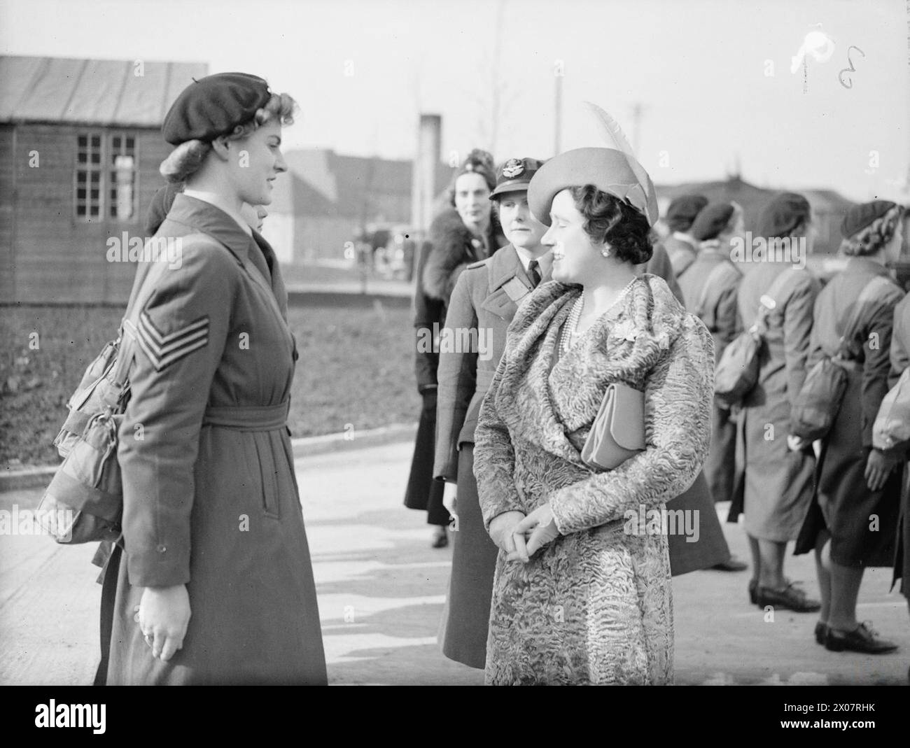 Queen Elizabeth speaks with a WAAF sergeant during a visit to an early ...