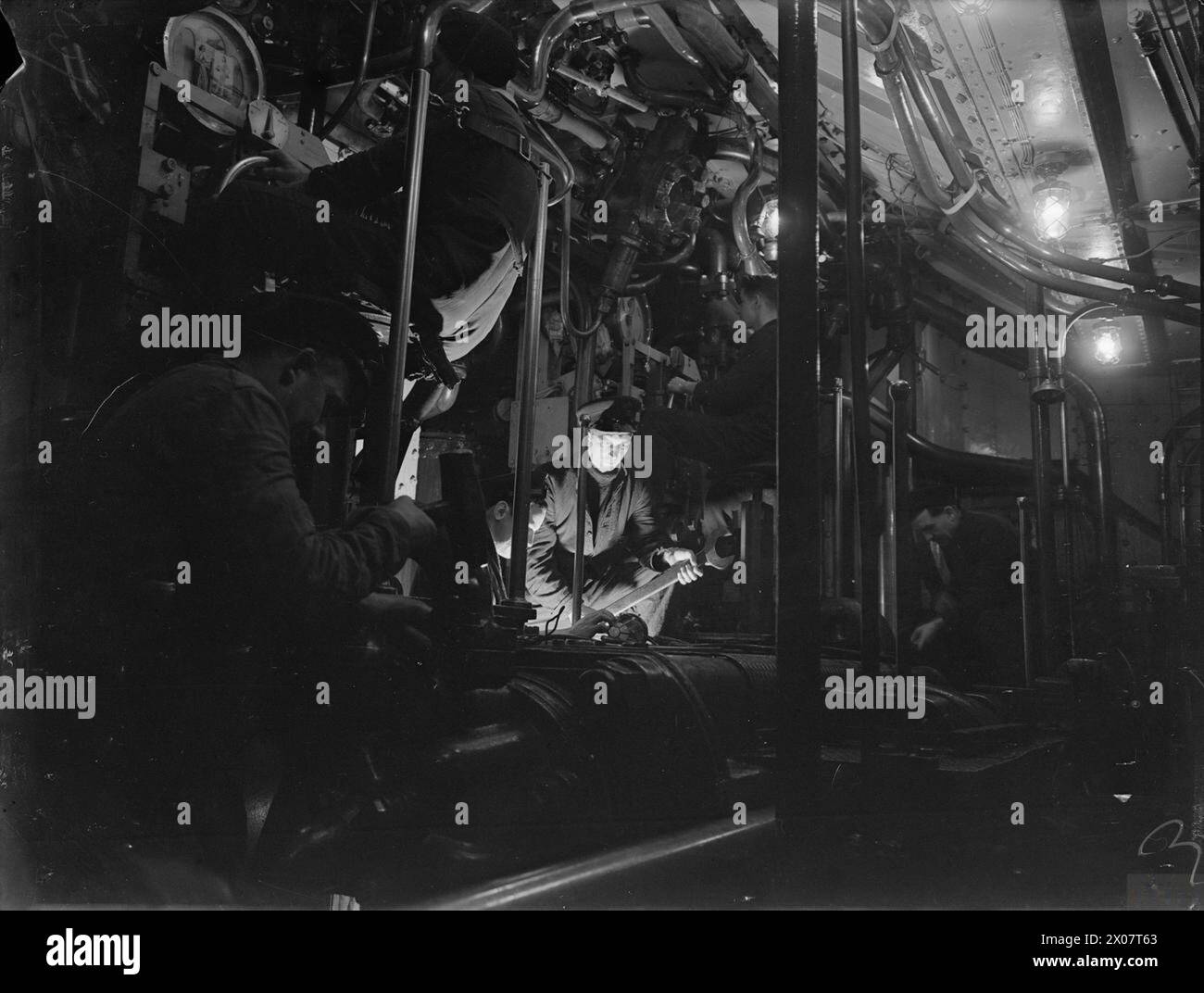 ON BOARD THE BATTLESHIP HMS RODNEY AT SEA. 1940. - In the training ...