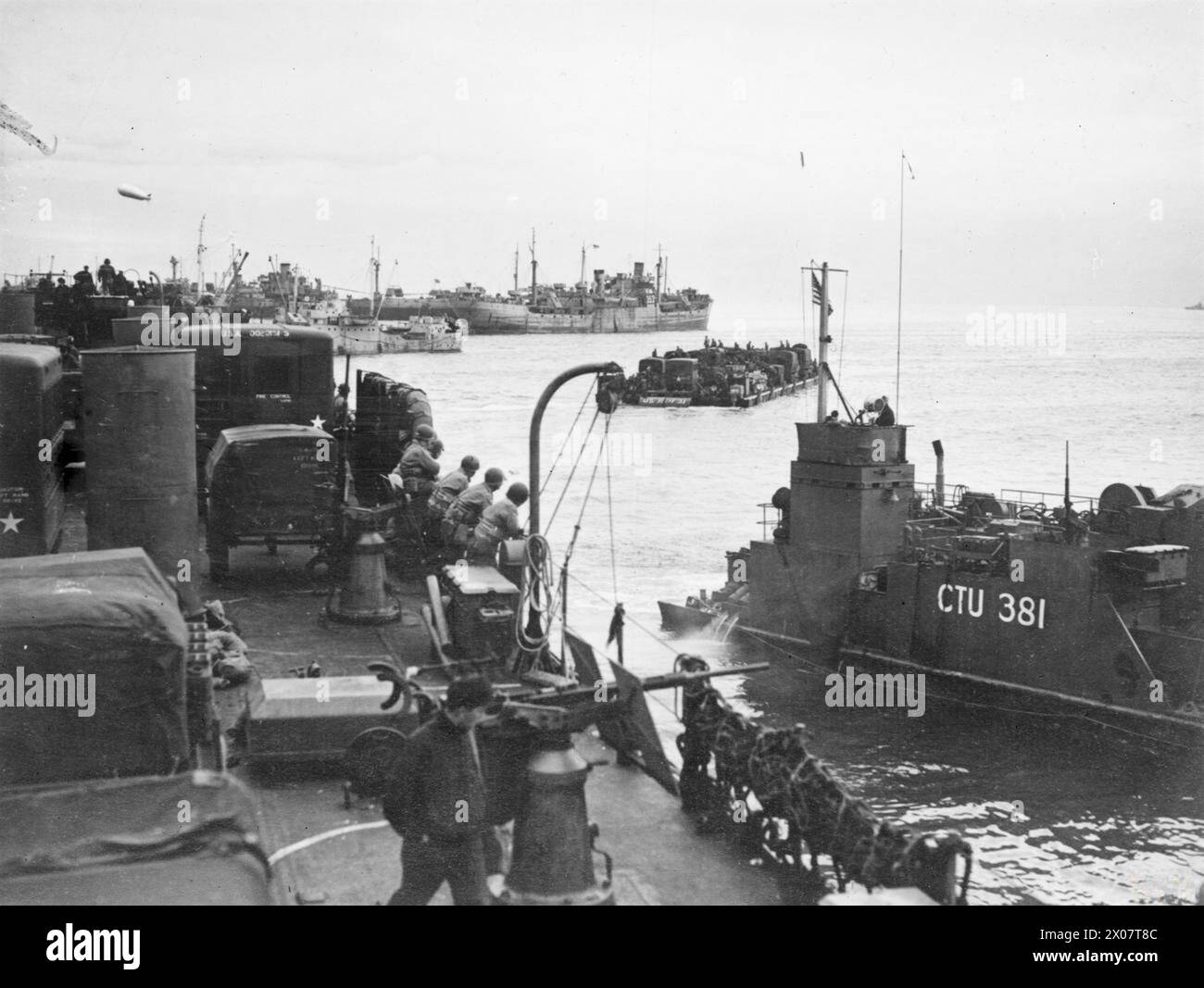 RHINO FERRIES LAND HEAVY EQUIPMENT OFF NORMANDY. 14 JUNE 1944, ON BOARD ...
