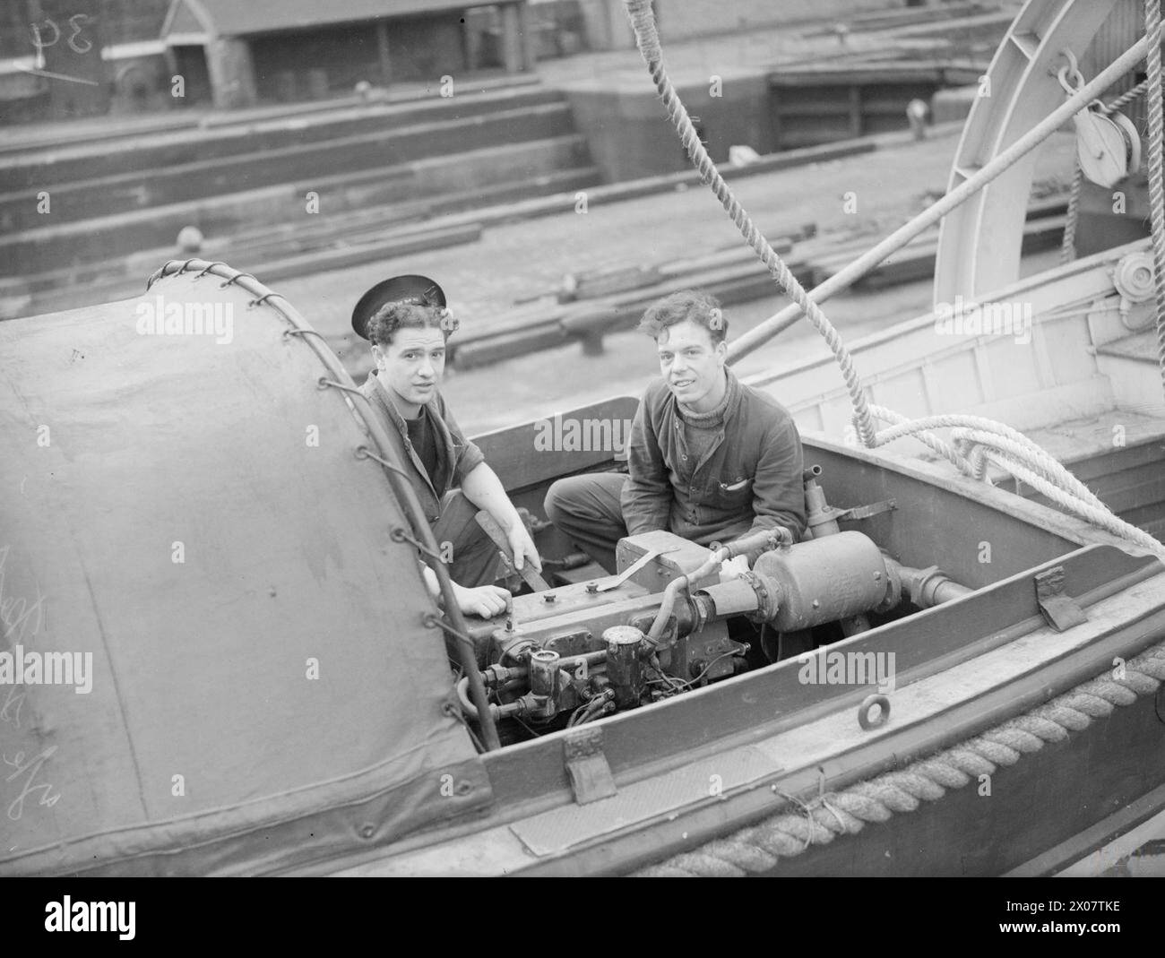 Crew of HMS Aylmer, a Captain-class frigate, perform maintenance on a ...