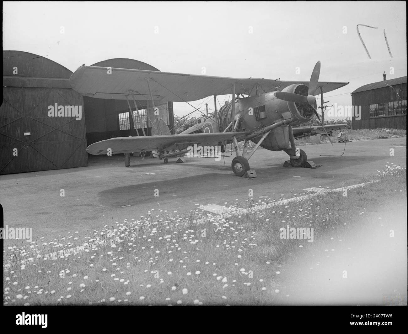 THE ROYAL NAVY DURING THE SECOND WORLD WAR - A Fairey Swordfish Mark III in front of hangars at ...