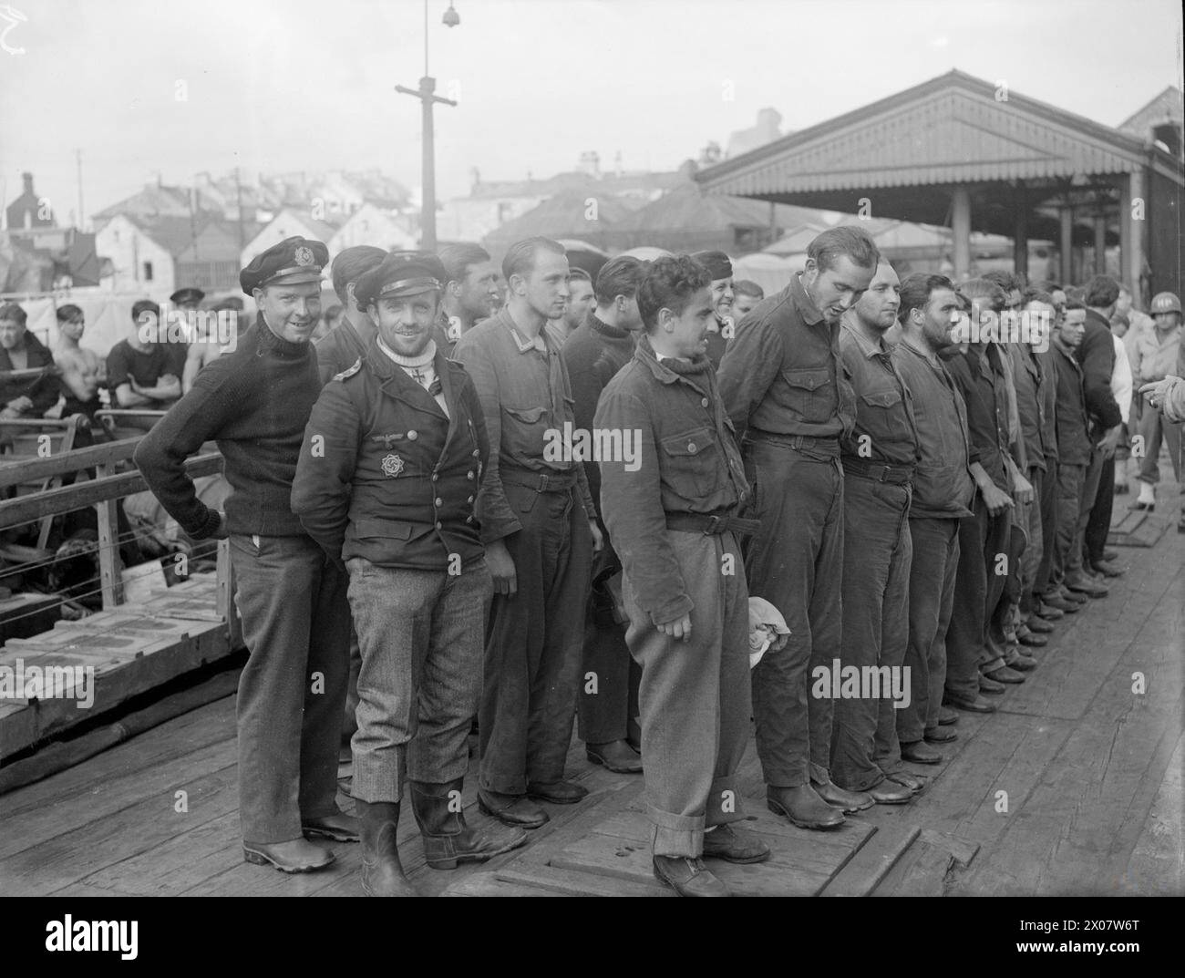 U-boat prisoners are landed at Plymouth on 19 July 1944 after being ...