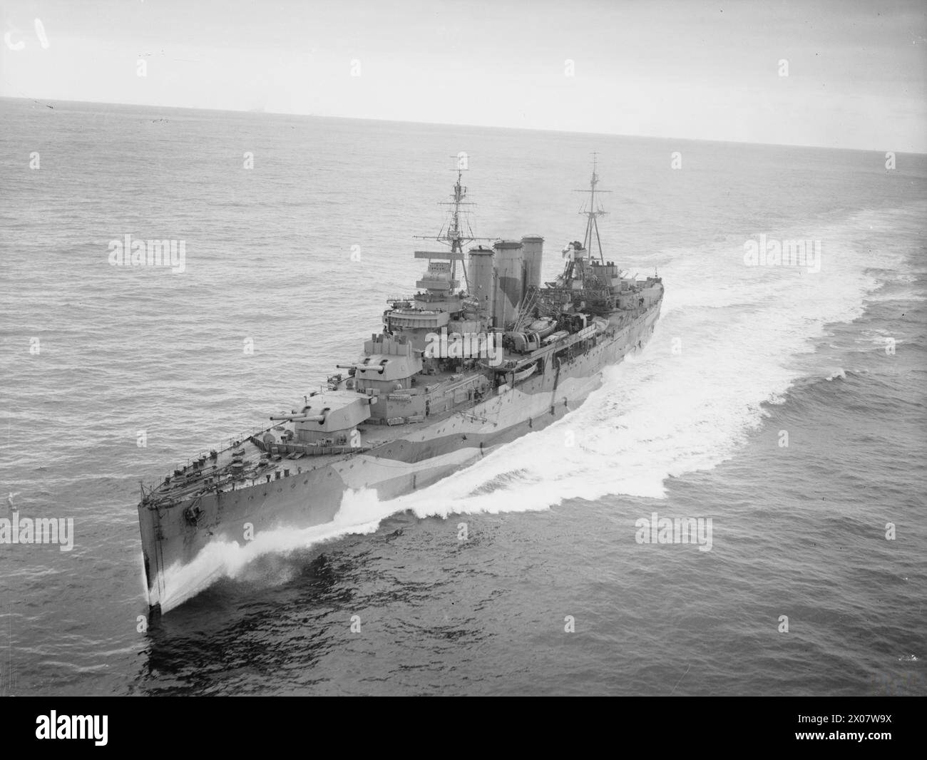 On 28 October 1941, aerial photographs capture HMS Kent, a Royal Navy ...