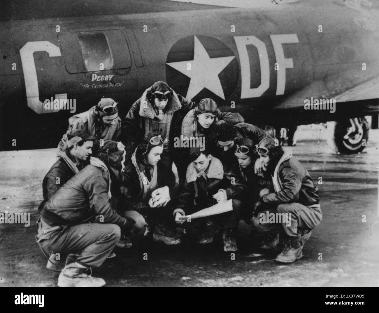The 91st Bomb Group bomber crew plan a daylight raid in front of B-17 ...