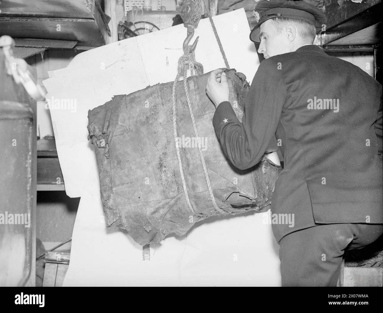 BALES OF RUBBER FROM SUNK U-BOAT. 11 SEPTEMBER 1943, LIVERPOOL. BALES ...