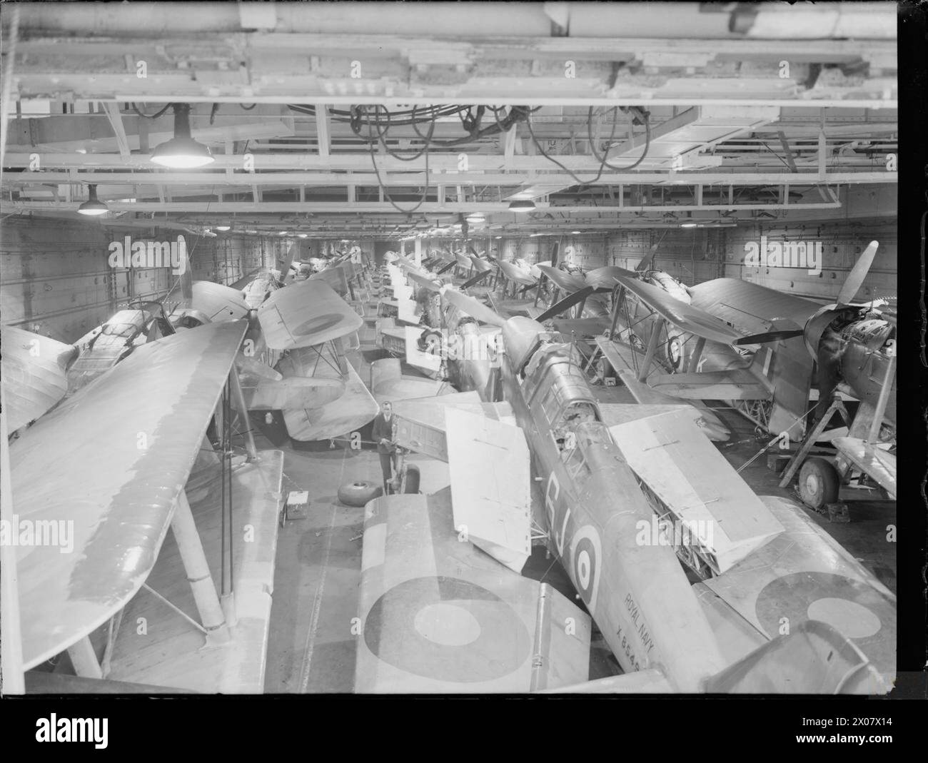 At Hvalfjord, Iceland, HMS Victorious hangar deck displays a row of ...