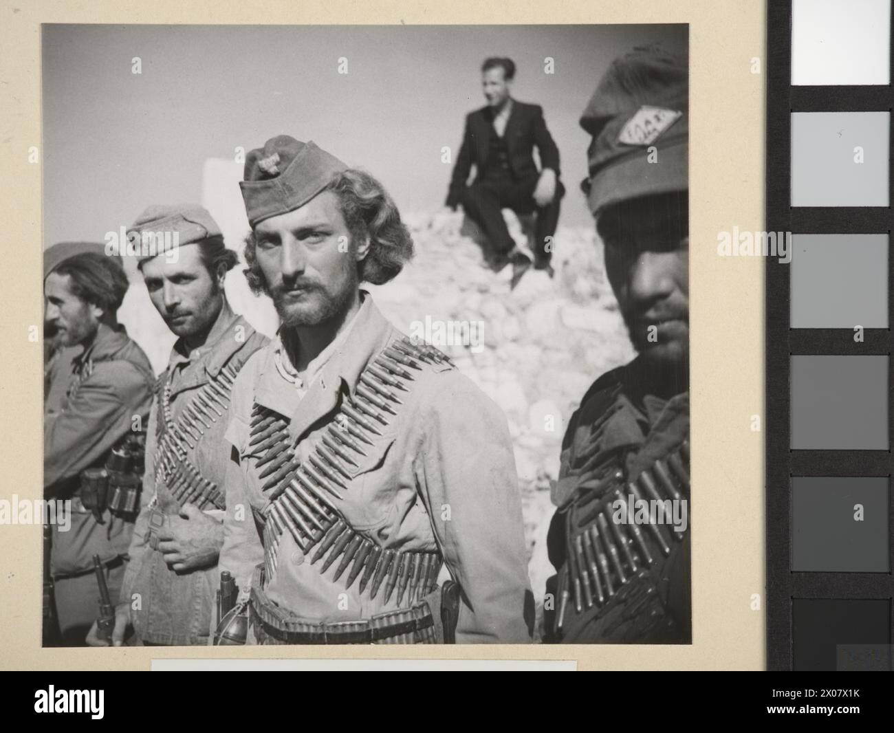 Greek partisans of various units are drawn up on parade in Athens as ...