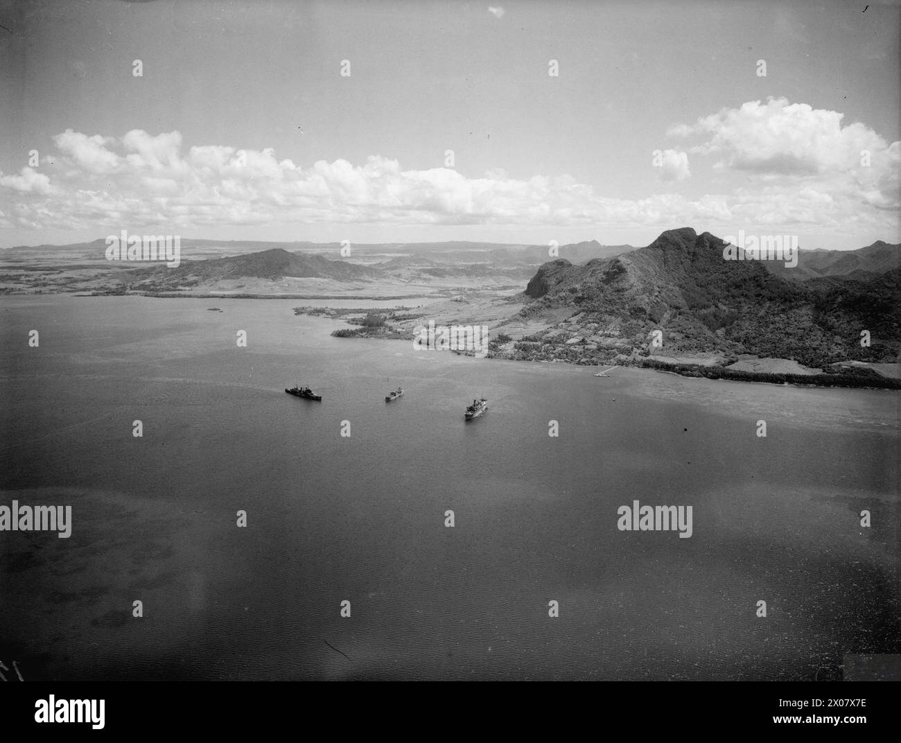 Aerial photographs show Grand Port in Mauritius and HMS Mauritius ...