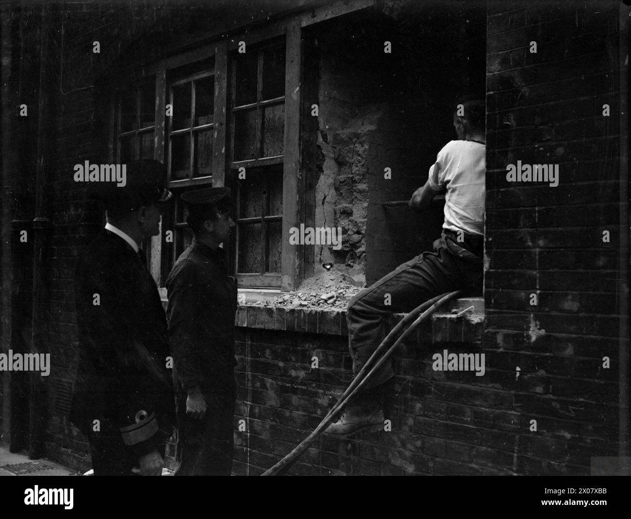 VC ADMIRAL INSPECTS SAILORS REPAIRING LONDON HOUSES. 26 JULY 1945 ...