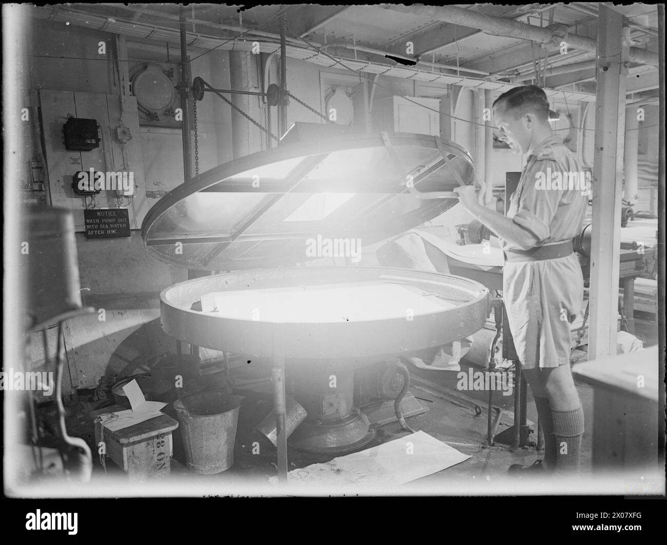 On board HMS White Bear at Colombo, Sergeant W H Baldwin tends a ...