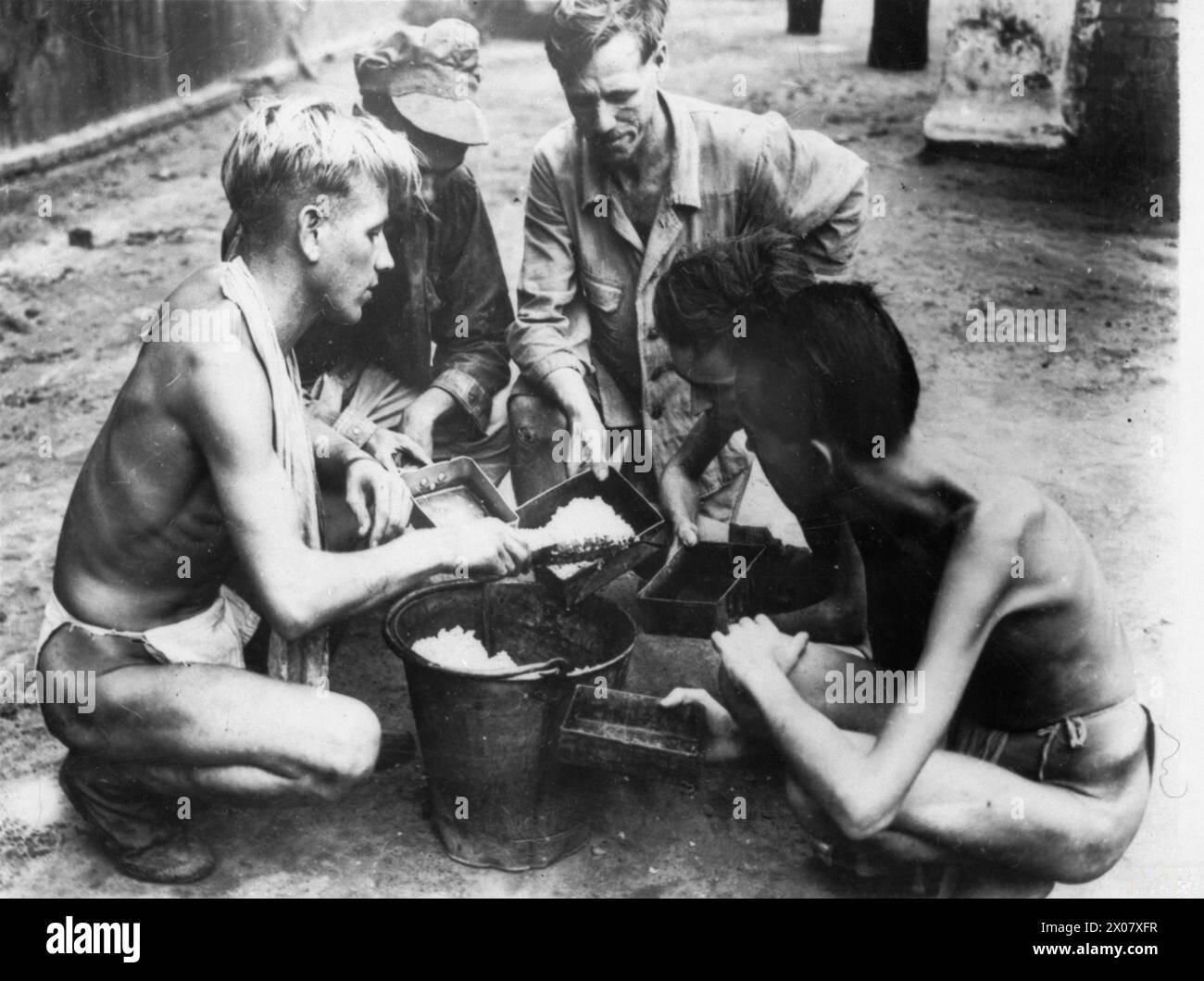 THE BRITISH ARMY IN BURMA 1945 - Liberated POWs at a Rangoon jail share ...