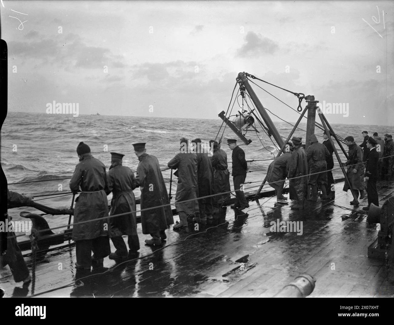 THE ROYAL NAVY DURING THE SECOND WORLD WAR - A paravane is hoisted over ...