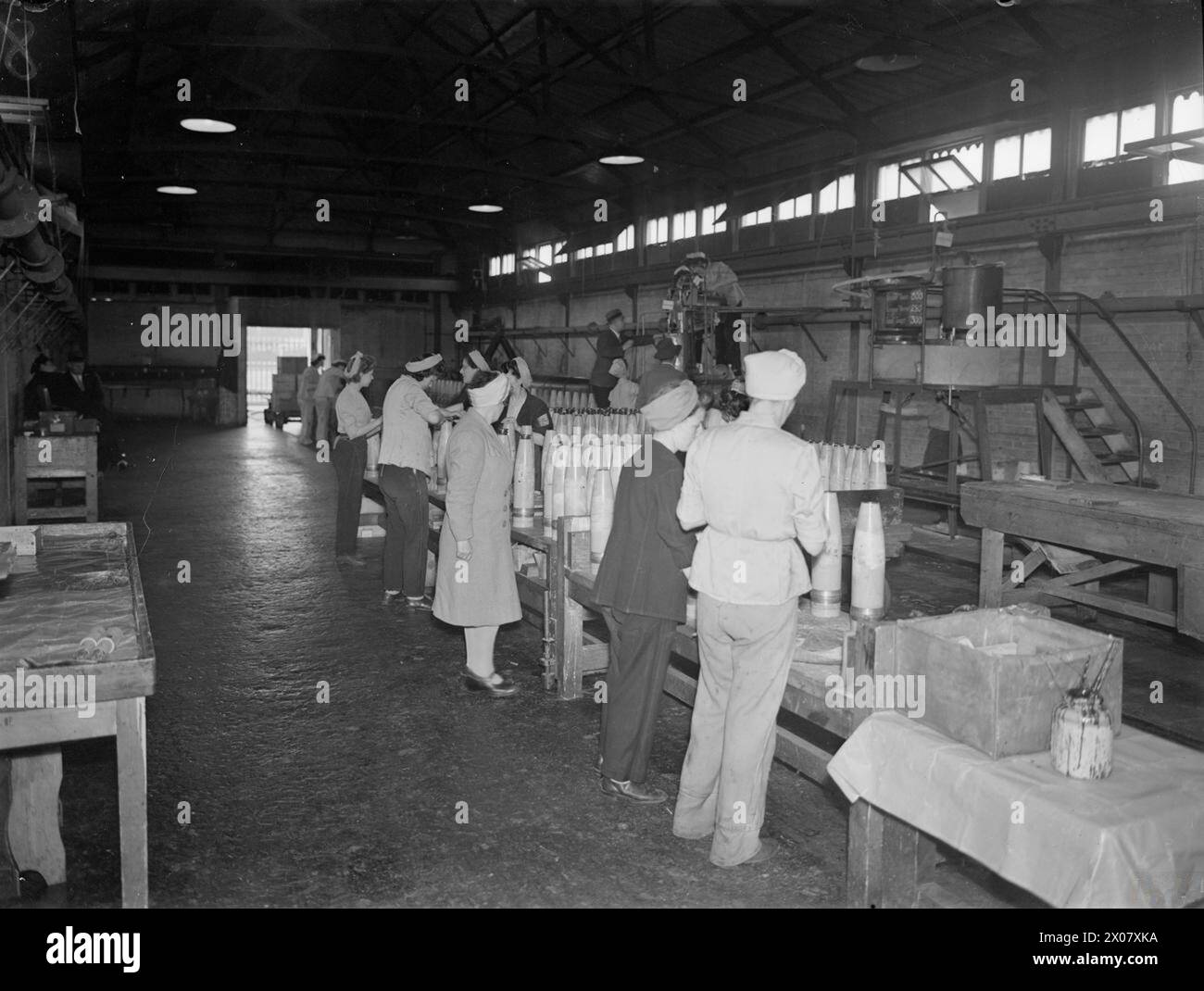 At Priddy's Hard Naval Armaments Factory from 25 to 30 July 1944, men ...