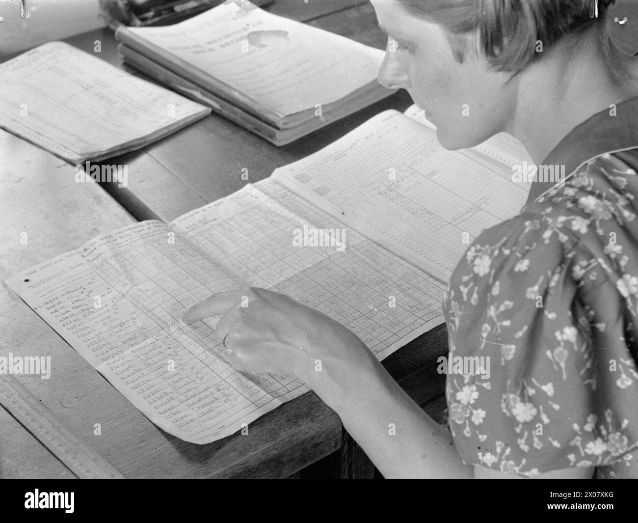 PARSONAGE FARM: DAIRY FARMING IN DEVON, ENGLAND, 1942 - A worker at Old ...
