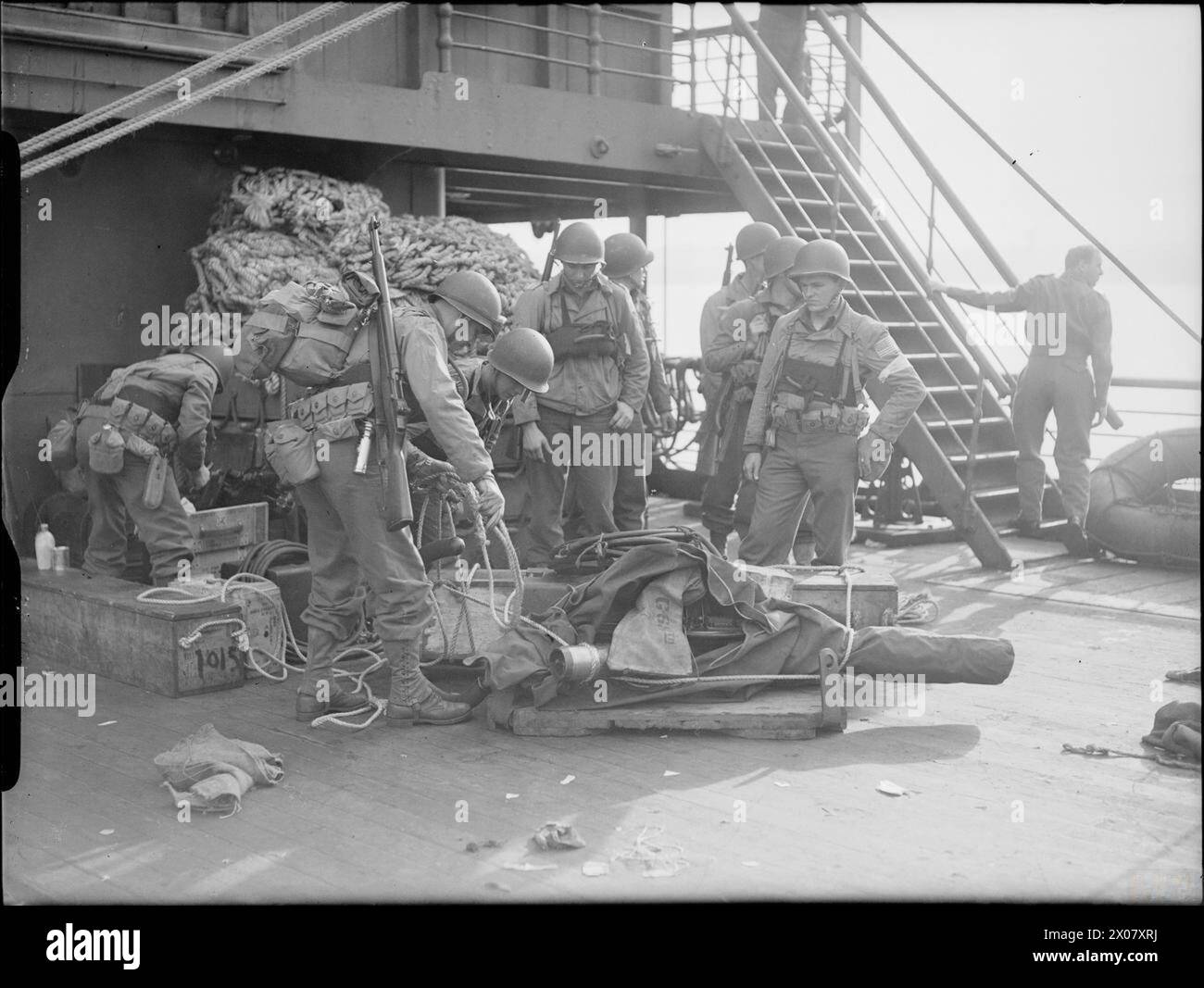 American troops prepare to unload supplies for the shore during ...