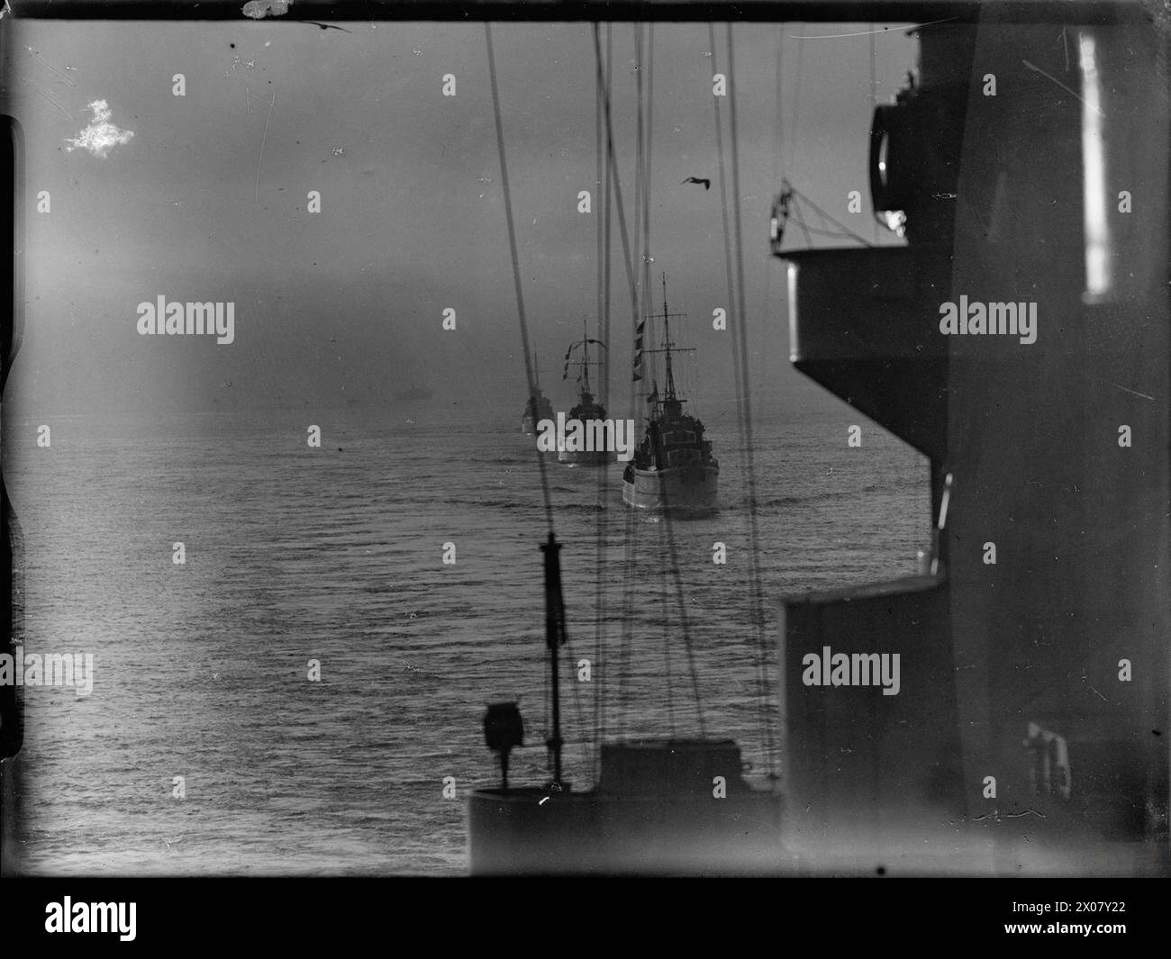 ON BOARD THE BATTLESHIP HMS RODNEY AT SEA. 1940. - Destroyers escorting ...