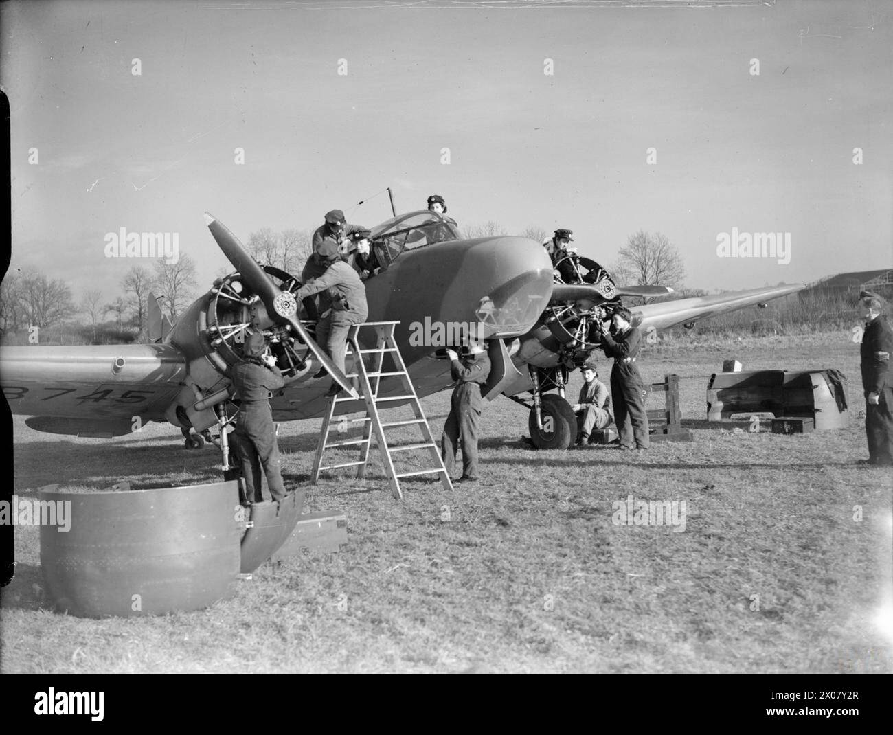 WAAF flight mechanics are overhauling an Airspeed Oxford aircraft at ...
