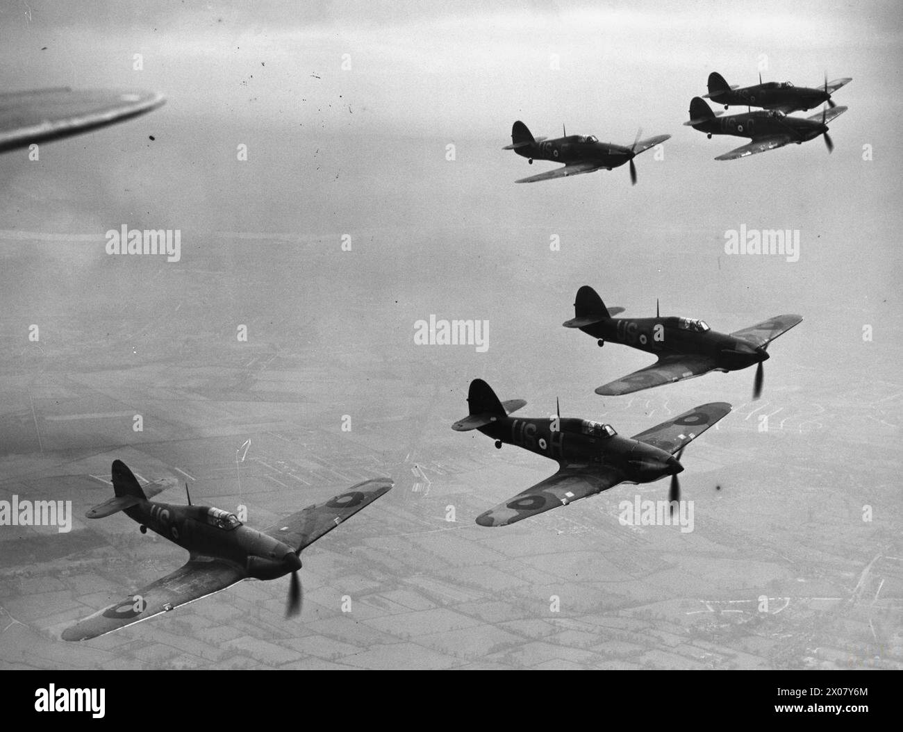 Hurricanes of No. 56 Squadron RAF Fighter Command are in flight over ...