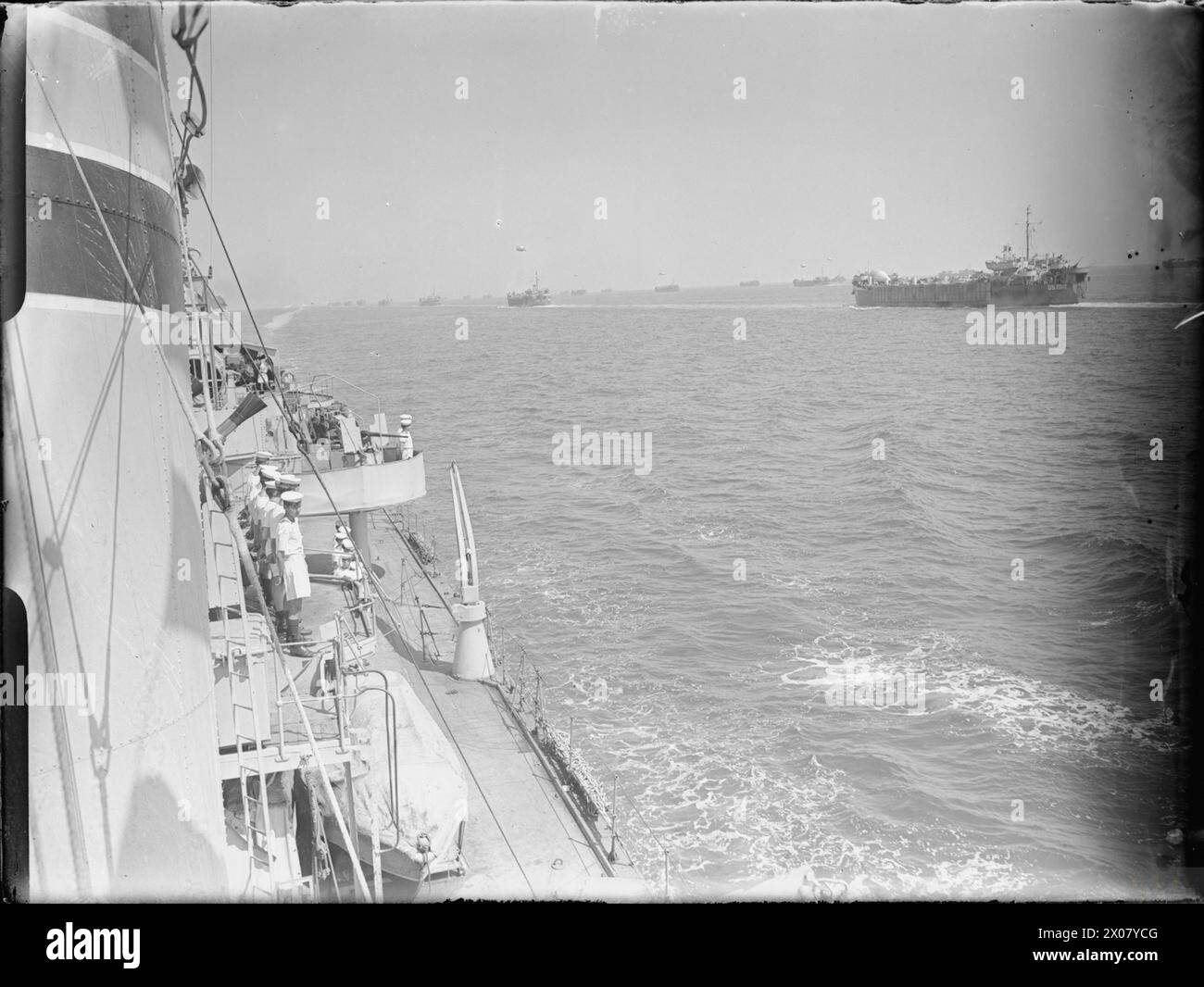 Men of HMS Kimberley lined the deck as the destroyer steamed alongside ...