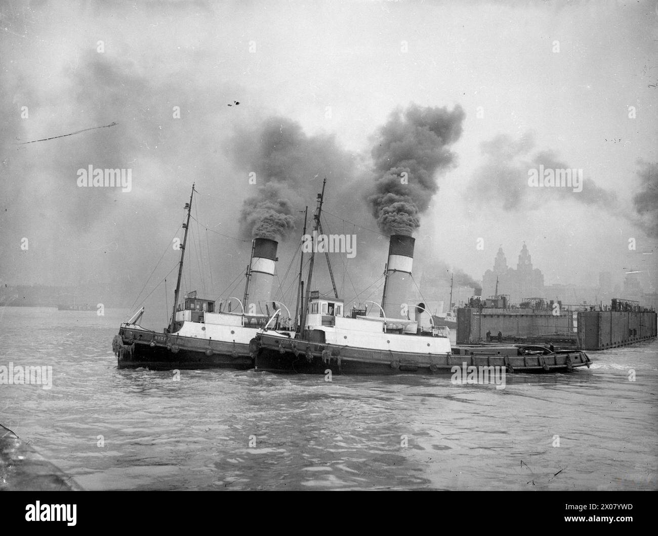 FLOATING DOCK IS TOWED OUT EAST. 28 MARCH 1945, ALFRED LOCK, BIRKENHEAD ...
