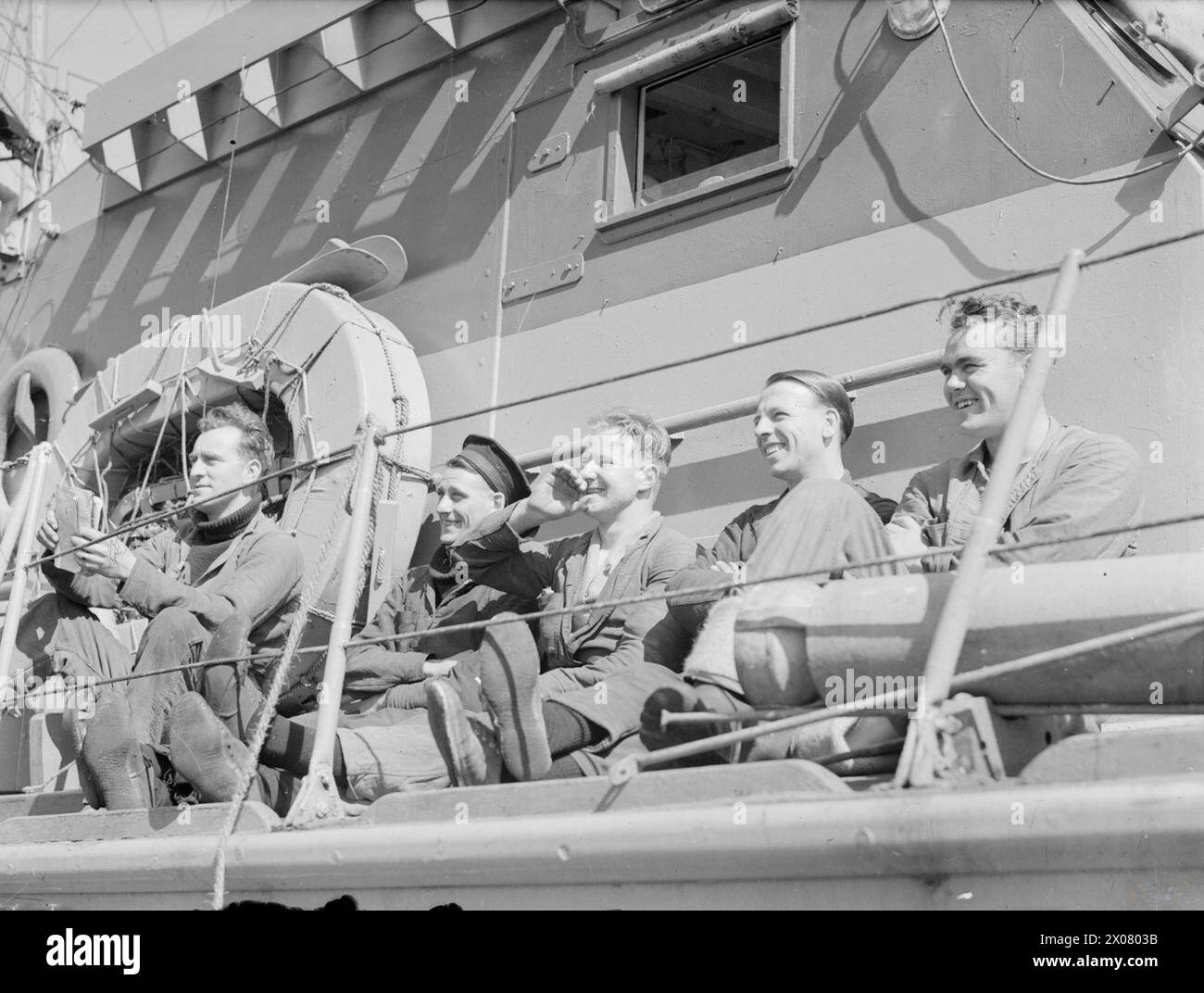 MOTOR GUN BOAT MEN IN HARBOUR. 10 AND 12 APRIL 1944, PORTSMOUTH. A MGB ...