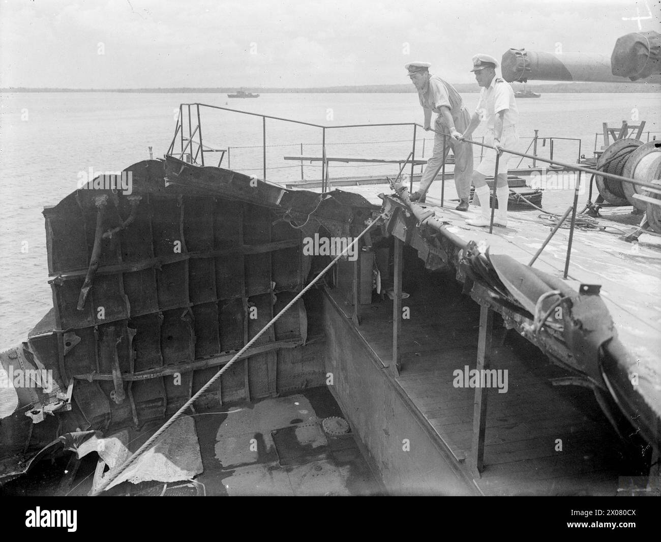 Captain M L Power and his staff inspect the stern of the Japanese ...
