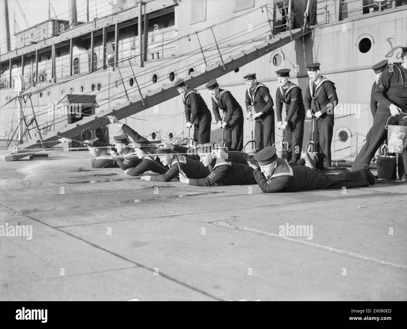 MEN OF THE ROYAL NAVY UNDERGOING TRAINING IN FIRE FIGHTING AT A NAVAL ...