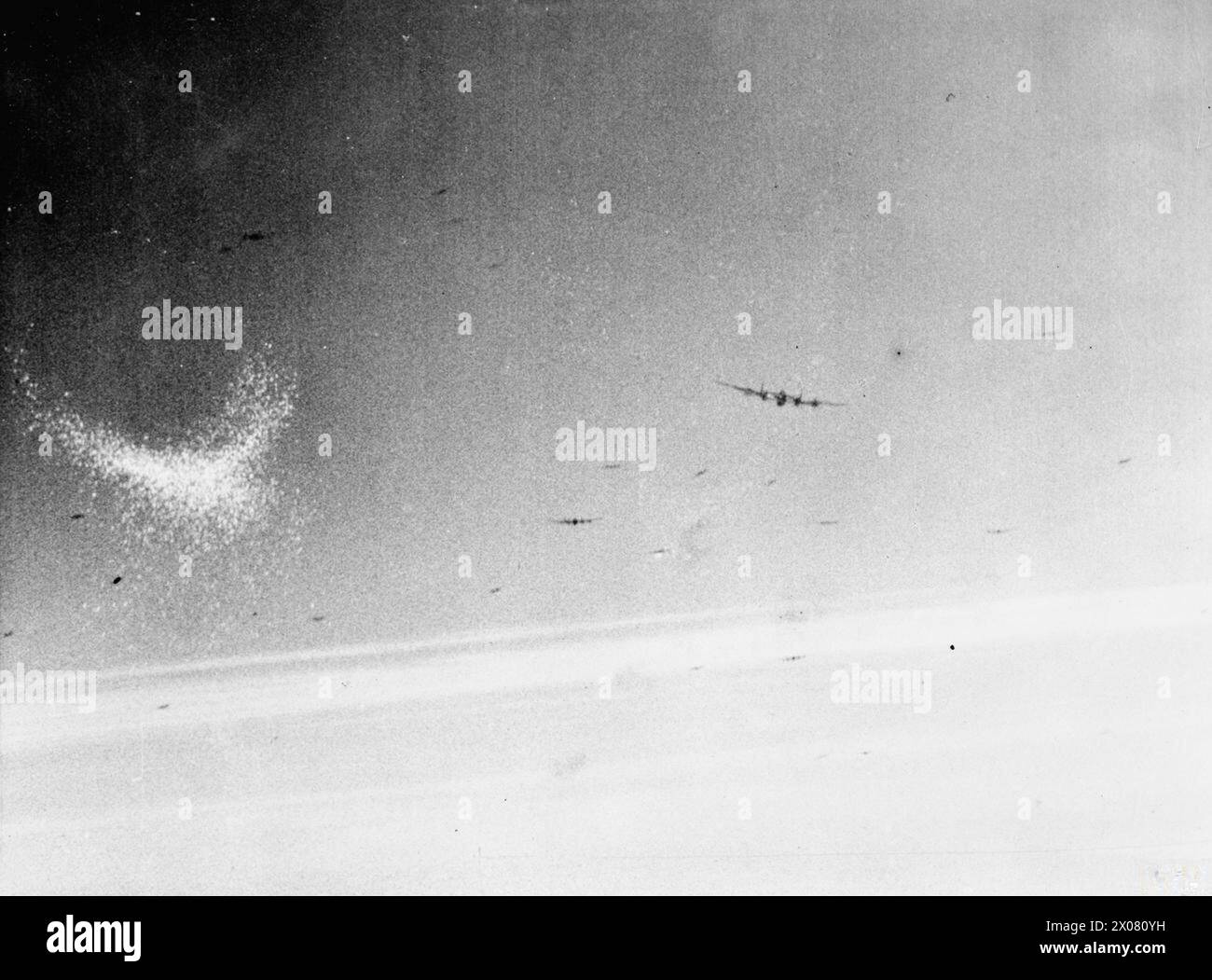Royal Air Force Avro Lancaster bomber is flying over Essen in 1943 ...