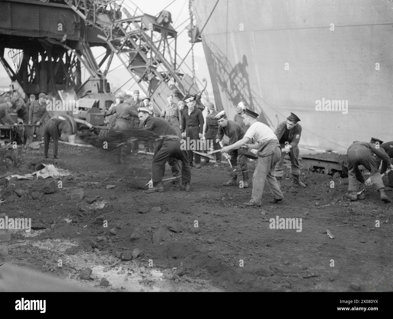 THE NAVY LENDS A HAND AT BONE: REPAIR WORK ASHORE AFTER ALL NIGHT ACTION. 26 AND 28 NOVEMBER ...
