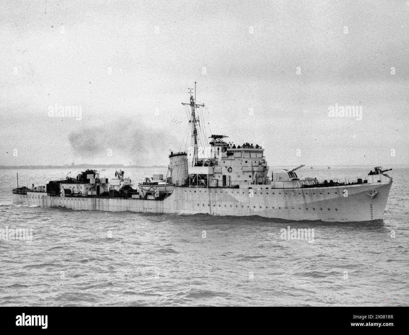 HMS Fernie, a Type I Hunt-class destroyer, is underway at Spithead ...