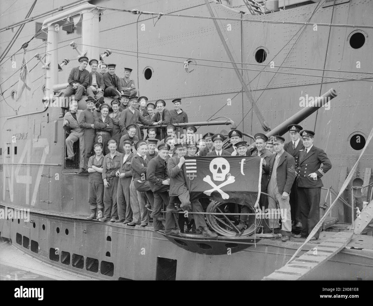 In October 1942, HM Submarine Seawolf is surfaced with officers and ...