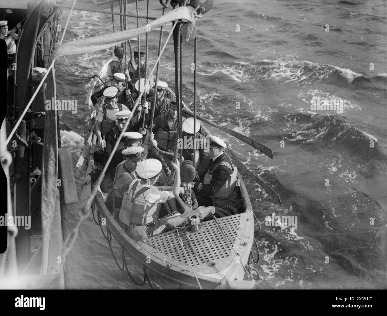 A twelve-man boarding party from HMS Sheffield inspects a merchant ship ...