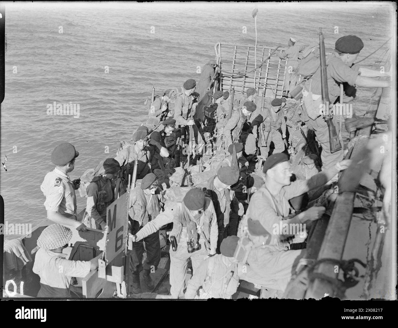 Royal Marines return to HMS Kenya off Cheduba, Burma, after completing ...