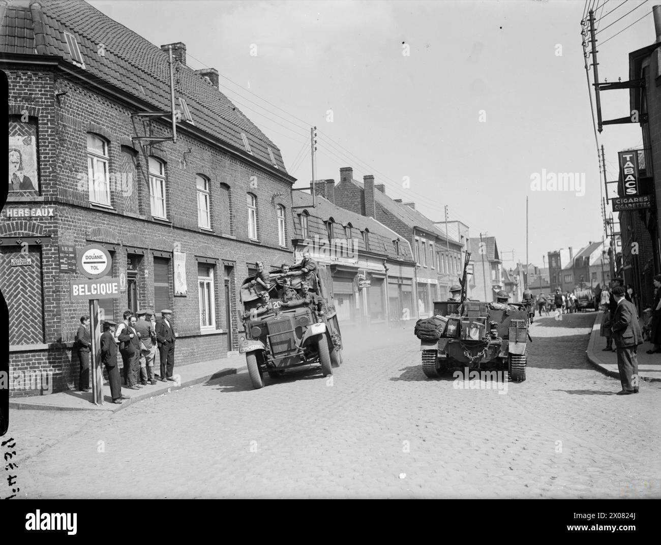 THE BRITISH ARMY IN FRANCE AND BELGIUM 1940 - Carriers and trucks move ...