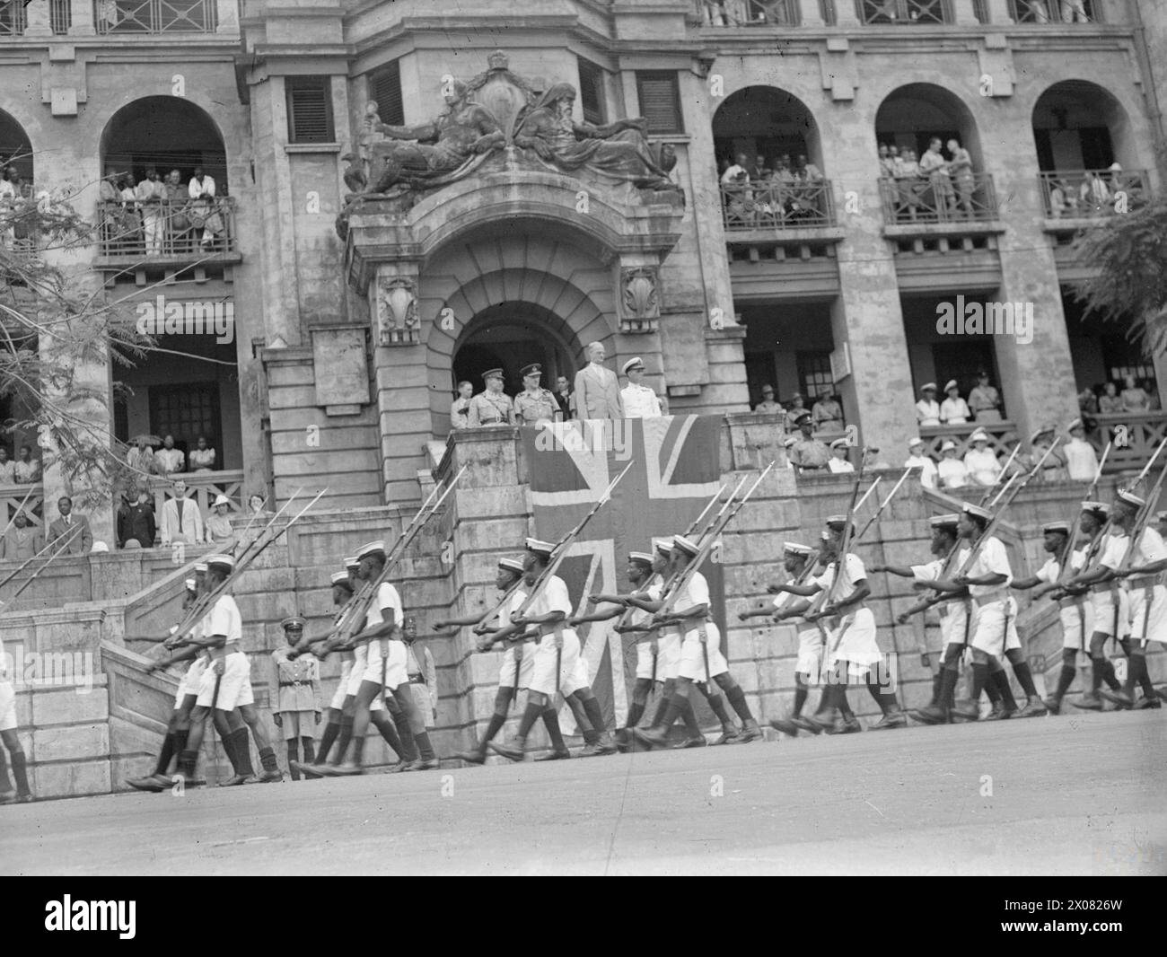 African Naval ratings of the Royal Navy march past the Governor of ...