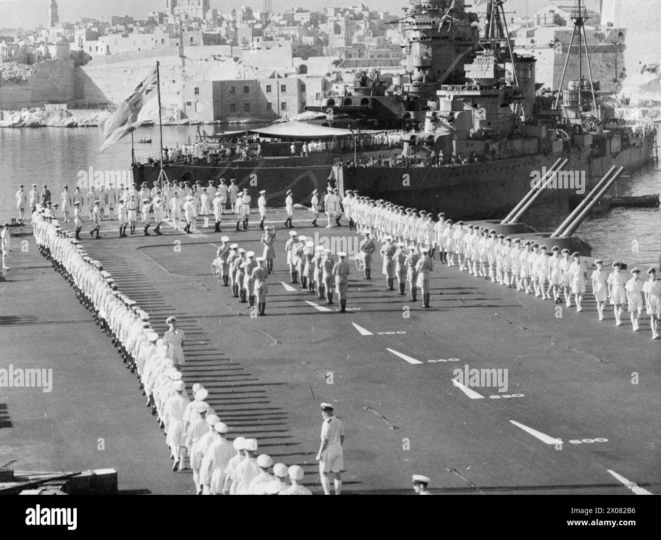 A photograph showing the ship's company of HMS Illustrious marching ...